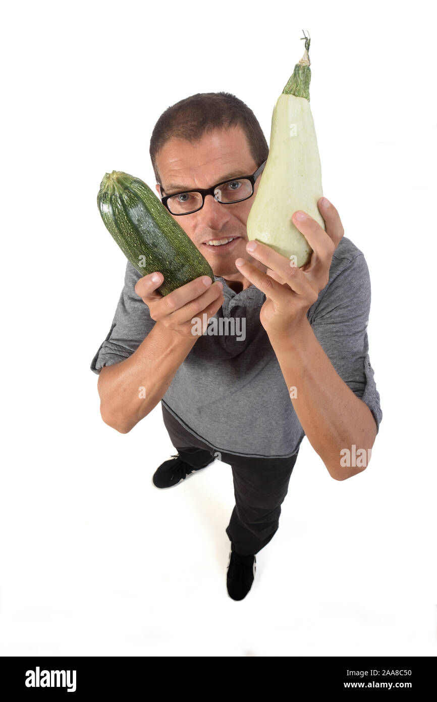 portrait of a man with zucchini on white background Stock Photo - Alamy