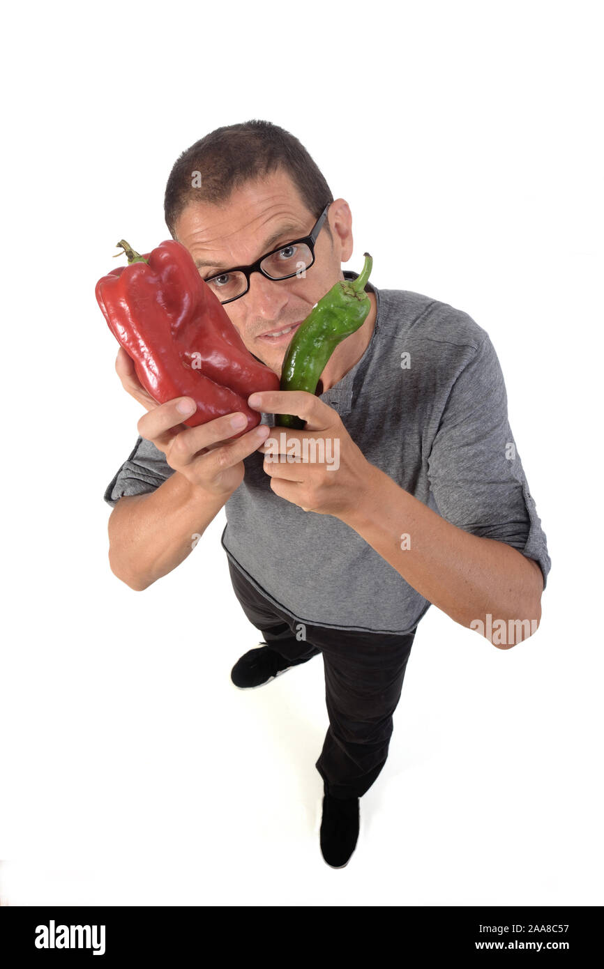 portrait of a man with Red pepper and green pepper on white background ...