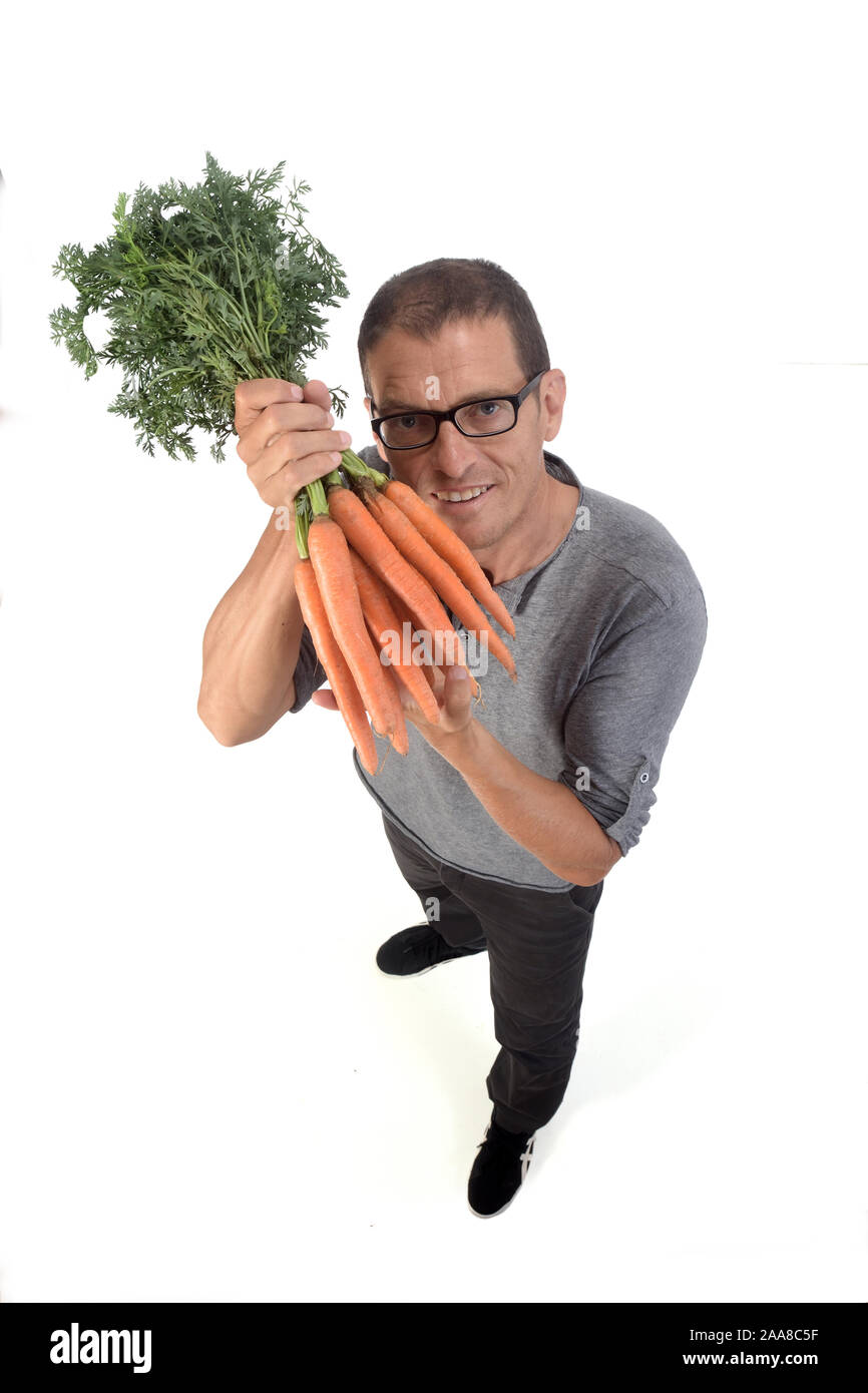 portrait of a man with carrots on white background Stock Photo - Alamy