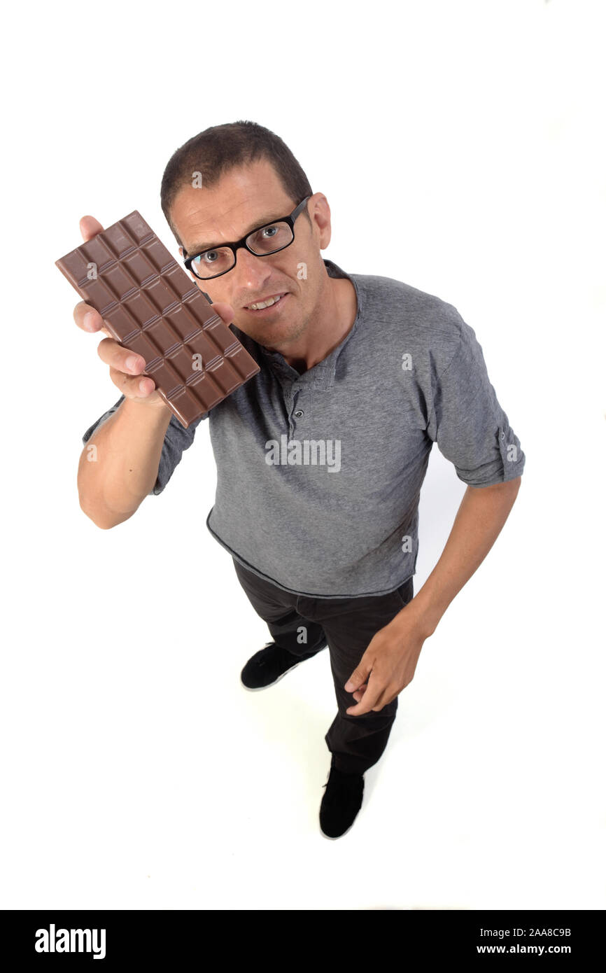 man with chocolate bar on white background Stock Photo - Alamy
