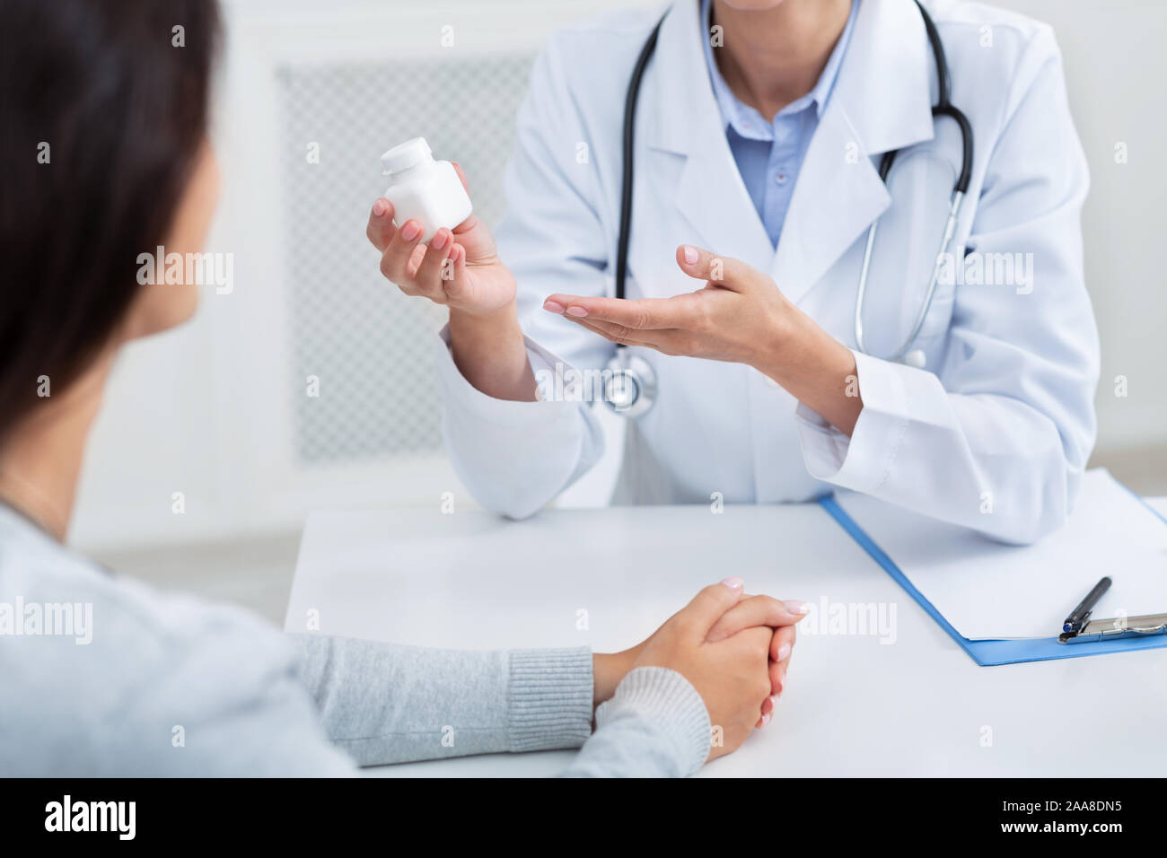 Doctor Giving Instructions On Treatment For Patient Sitting In Office ...