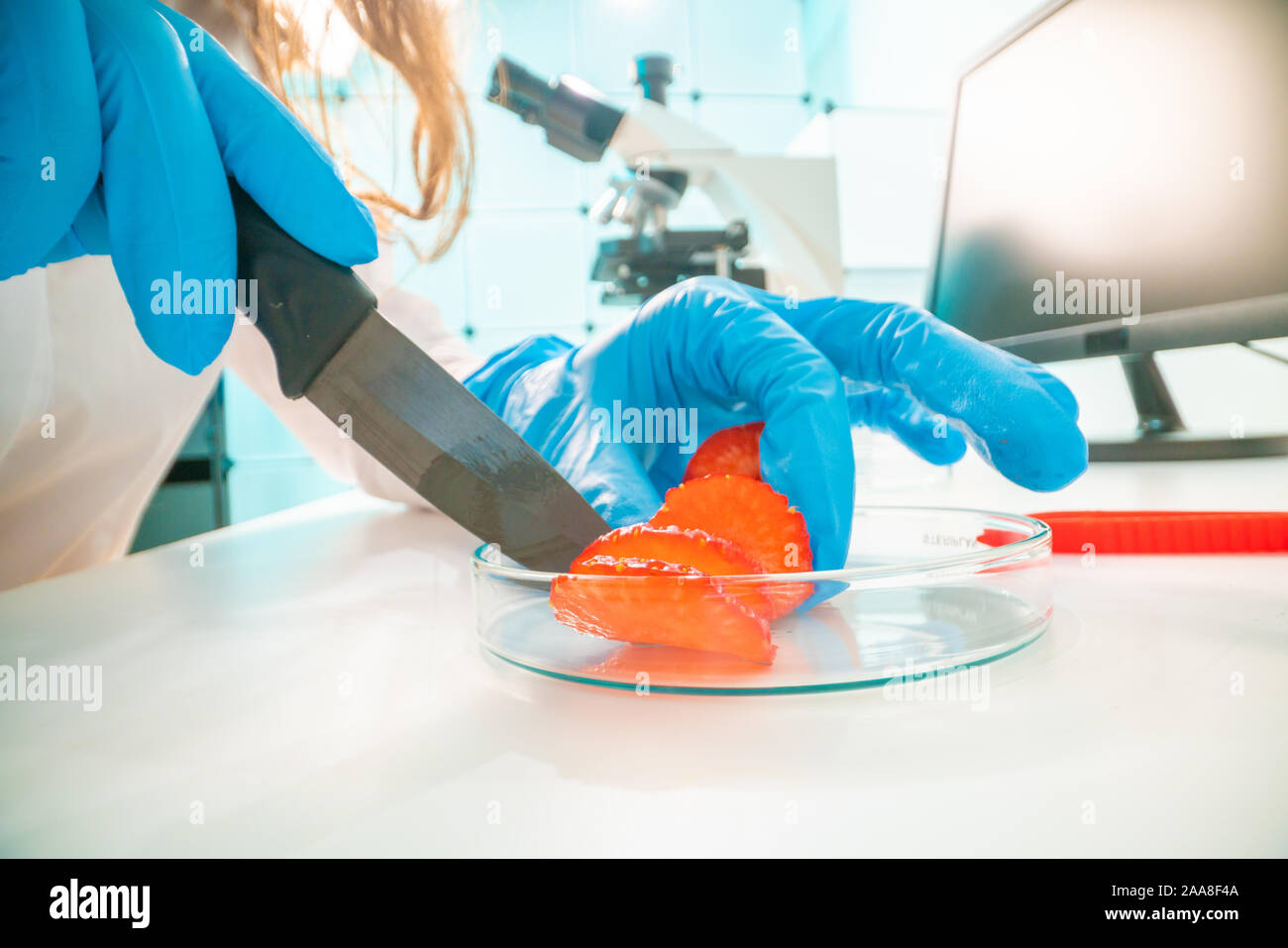 Young woman in food quality control lab Stock Photo - Alamy