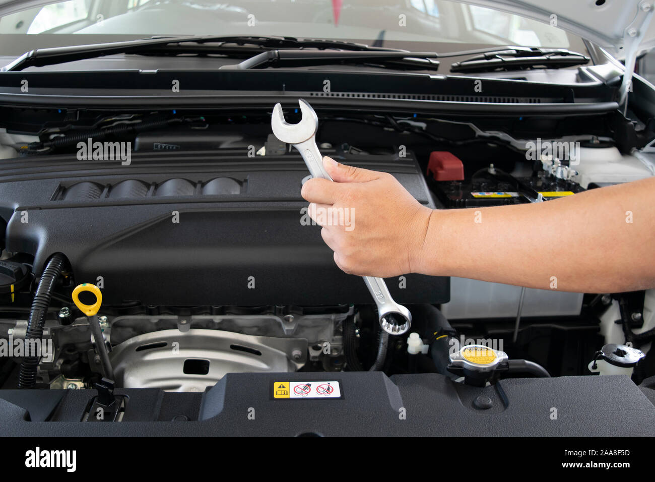 Car service concept, Mechanic Hand Hold Spanner Tool man checking the ...