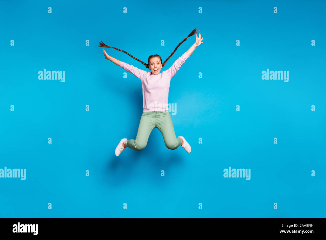 Full length photo of pretty crazy lady long braids flying jumping high ...
