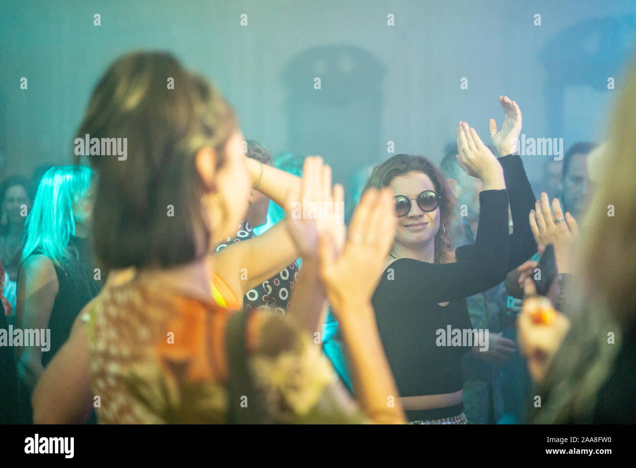 Party goers at the Lost in Disco club night at Bush Hall in London ...