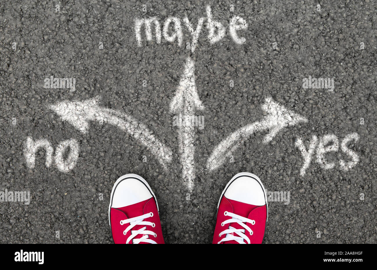 Teenager choosing between yes, maybe or no Stock Photo - Alamy