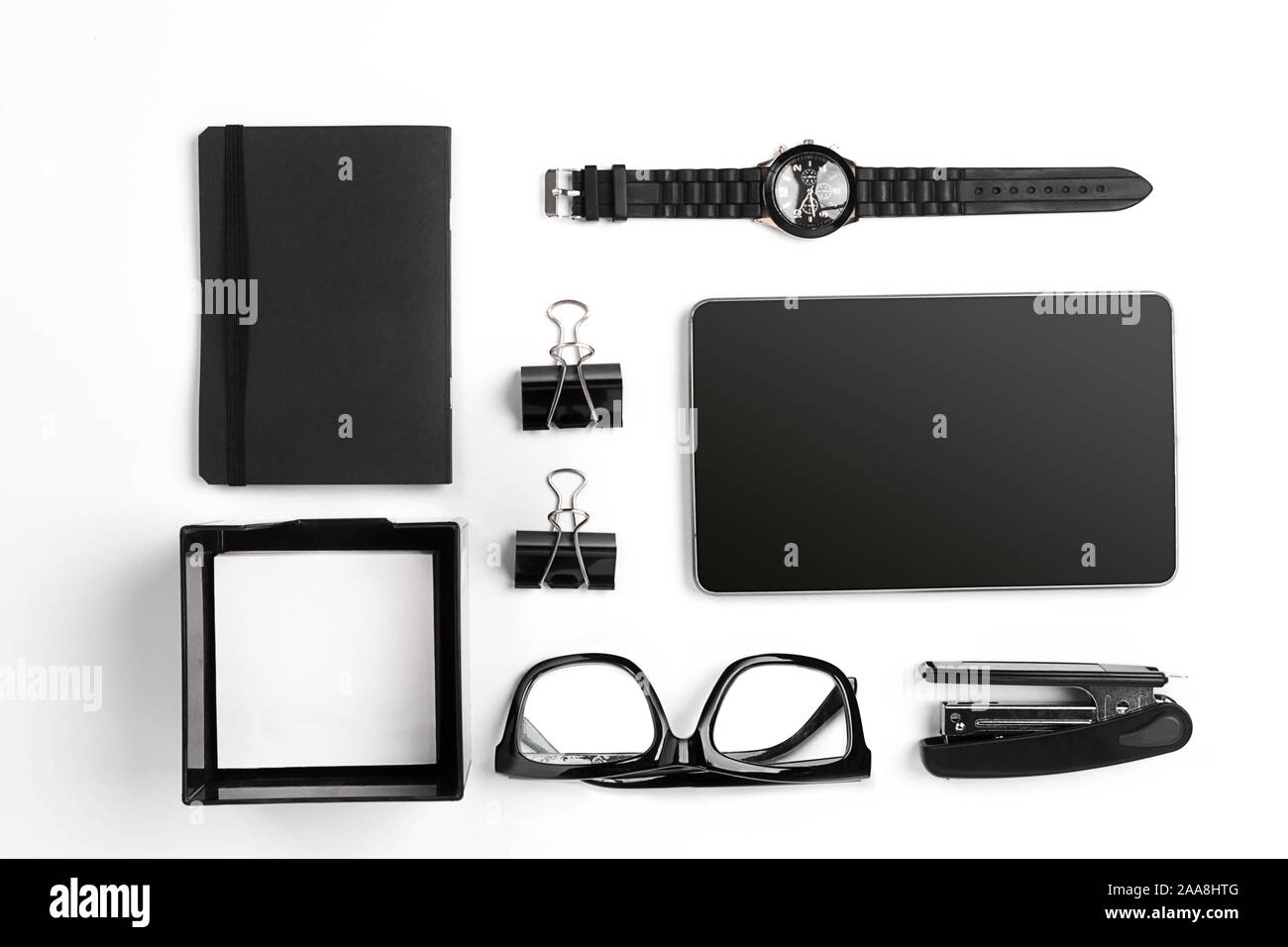 Mix of office supplies and business gadgets on a modern office desk ...