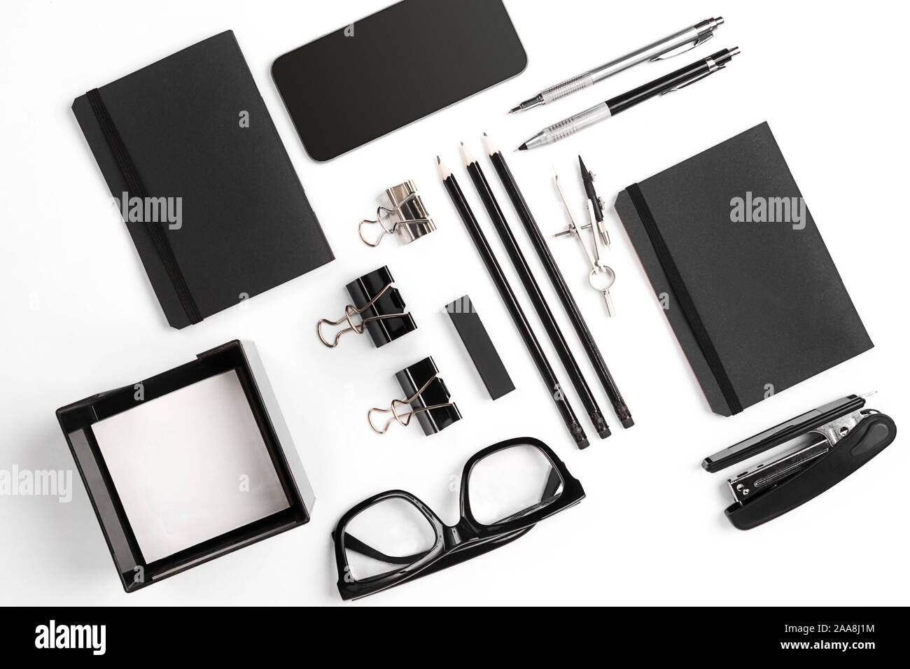 Mix of office supplies and business gadgets on a modern office desk ...