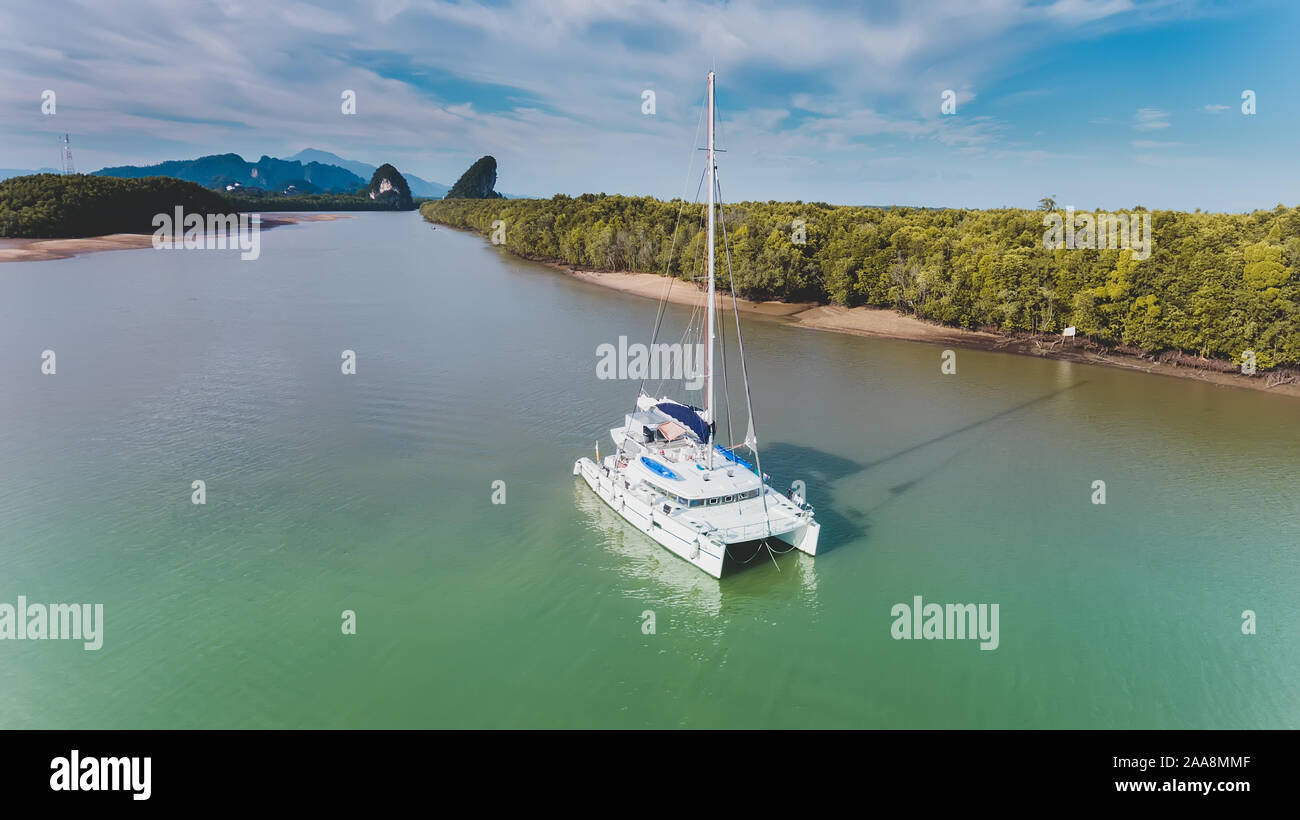 Top view from sky of long river and mangroves forrest with outdoor sun ...
