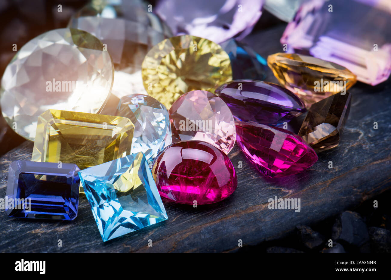 Collection mix colorful of gemstones jewelry on dark stone Stock Photo ...