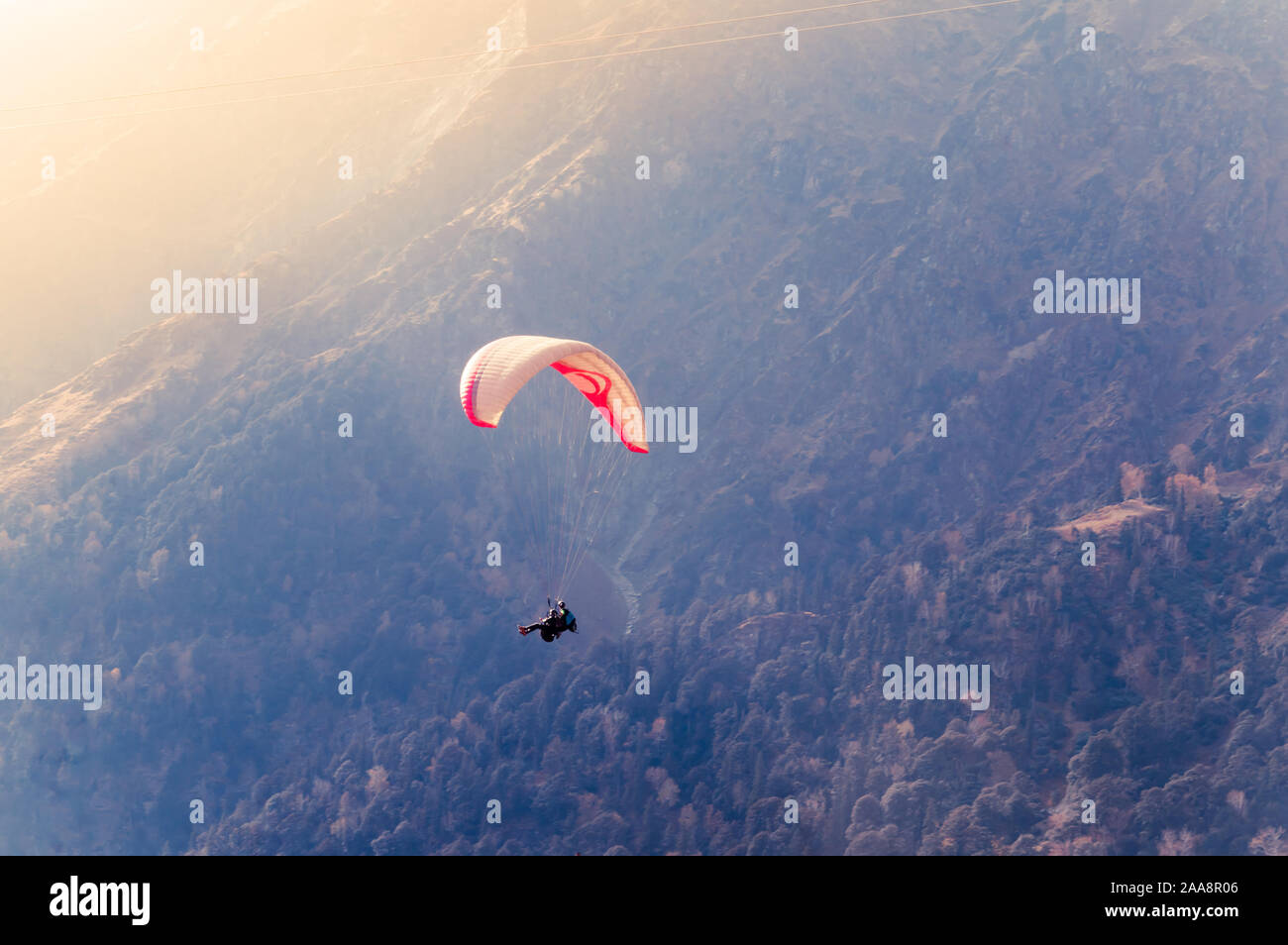 Close up of a Flying colorful parachute paragliding on beautiful ...