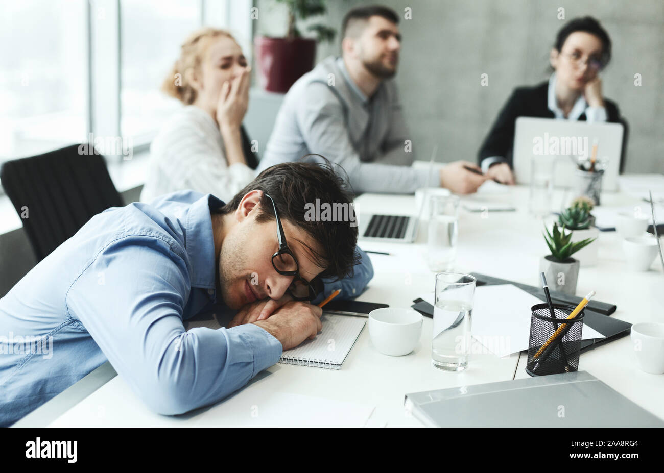 Boring presentation. Business man sleeping, lying on table Stock Photo ...