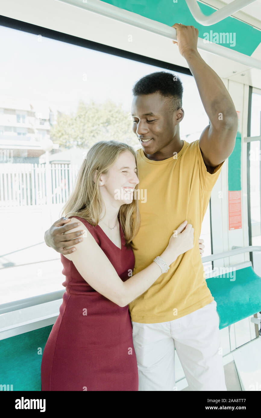 Boy and girl laughing and having fun on the bus Stock Photo - Alamy