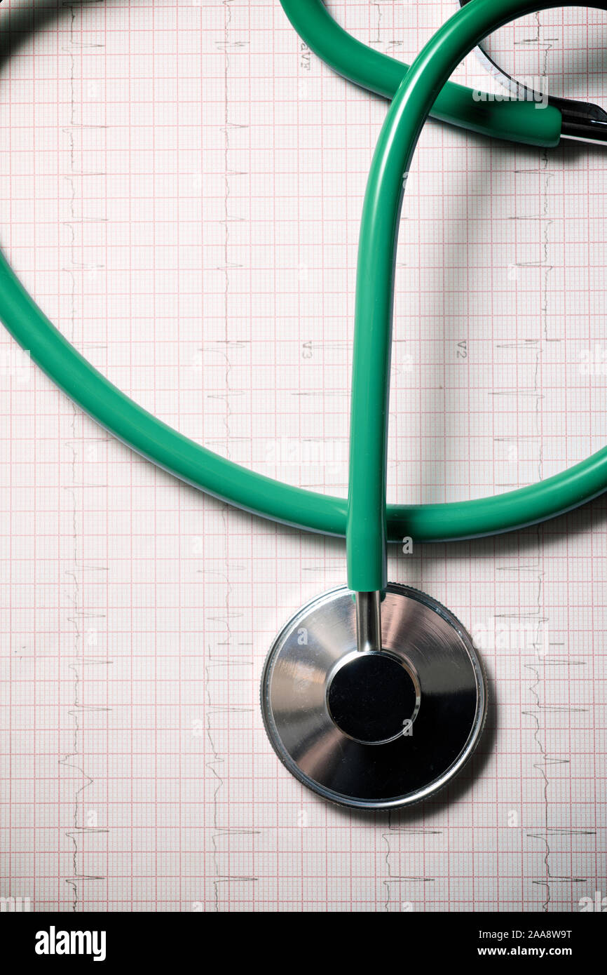 Stethoscope on a electrocardiogram paper form Stock Photo - Alamy