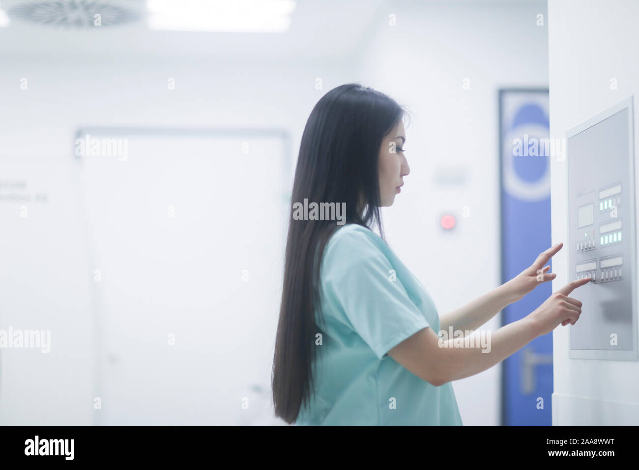 asia nurse checking a control panel Stock Photo - Alamy