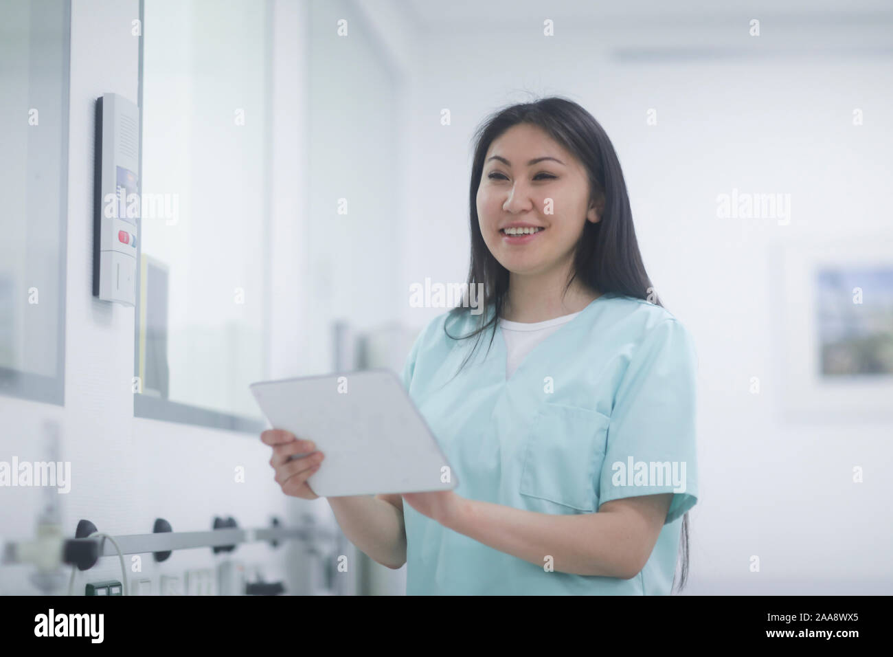asia woman nurse with tablet in a hospital Stock Photo - Alamy