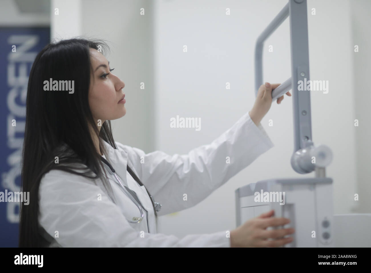 asia woman doctor checking device in a hospital Stock Photo - Alamy
