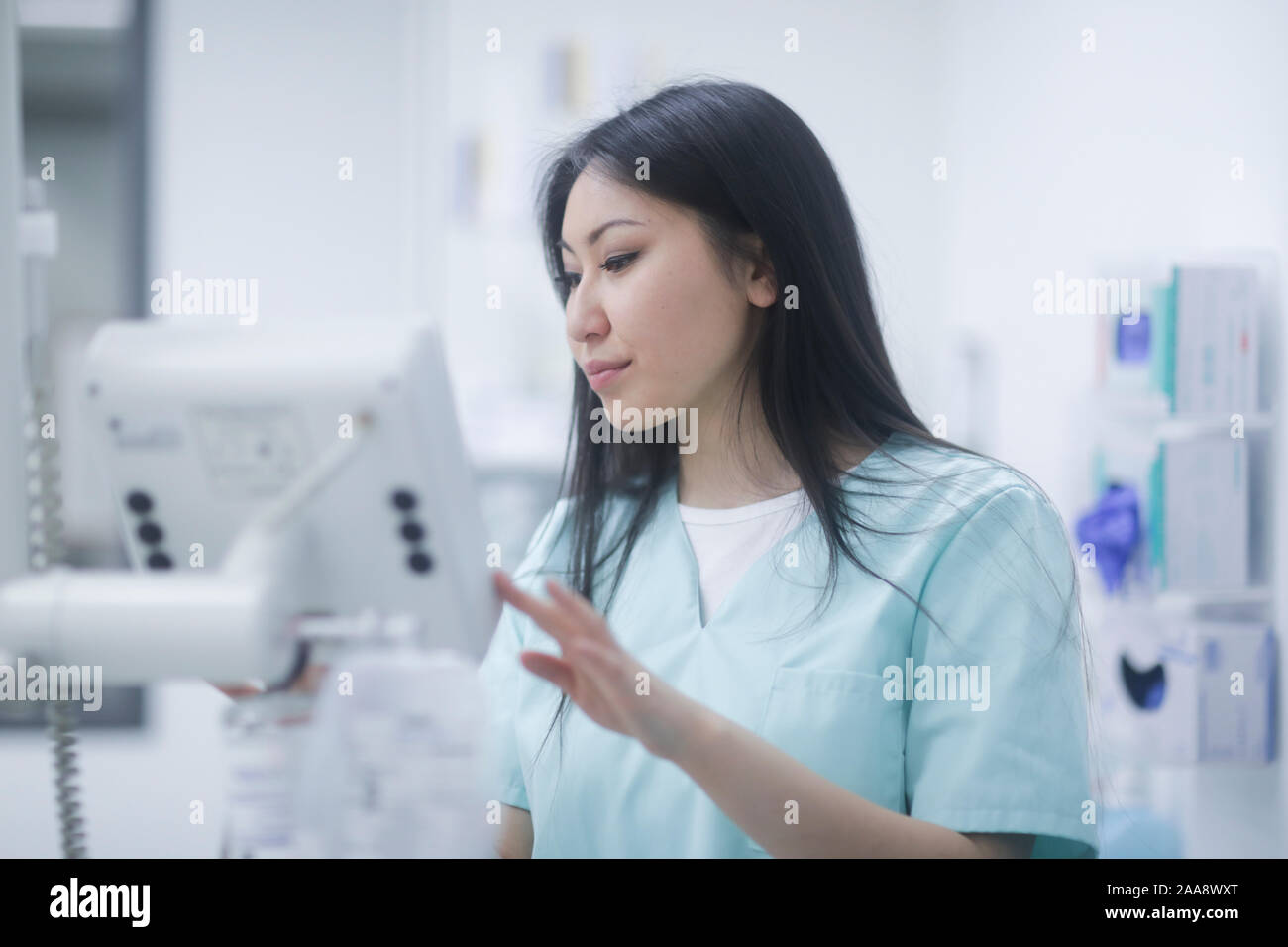asia woman nurse checking device in a hospital Stock Photo - Alamy