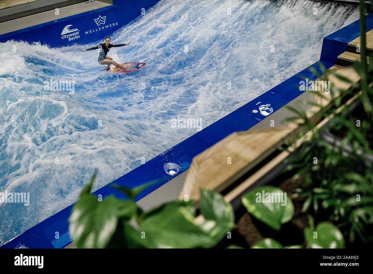 Berlin, Germany. 20th Nov, 2019. A surfer jumps on an artificial surf ...