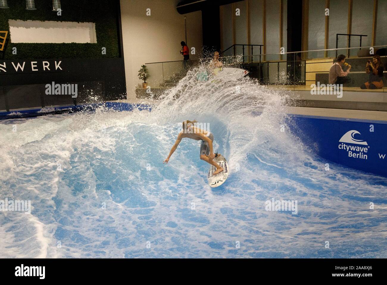 Berlin, Germany. 20th Nov, 2019. A surfer jumps on an artificial surf ...