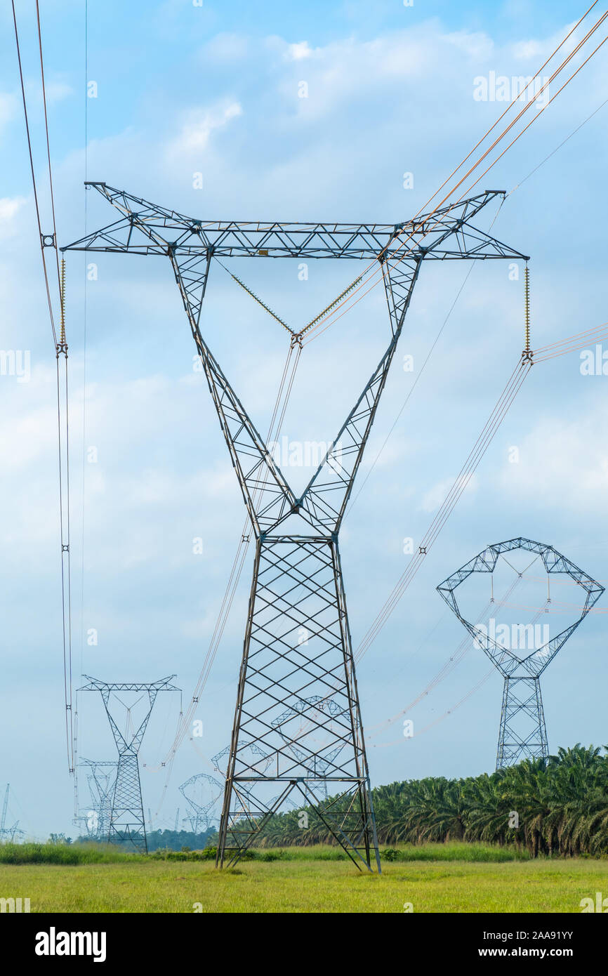 View of high electric voltage transmission tower, power pylon poles and ...