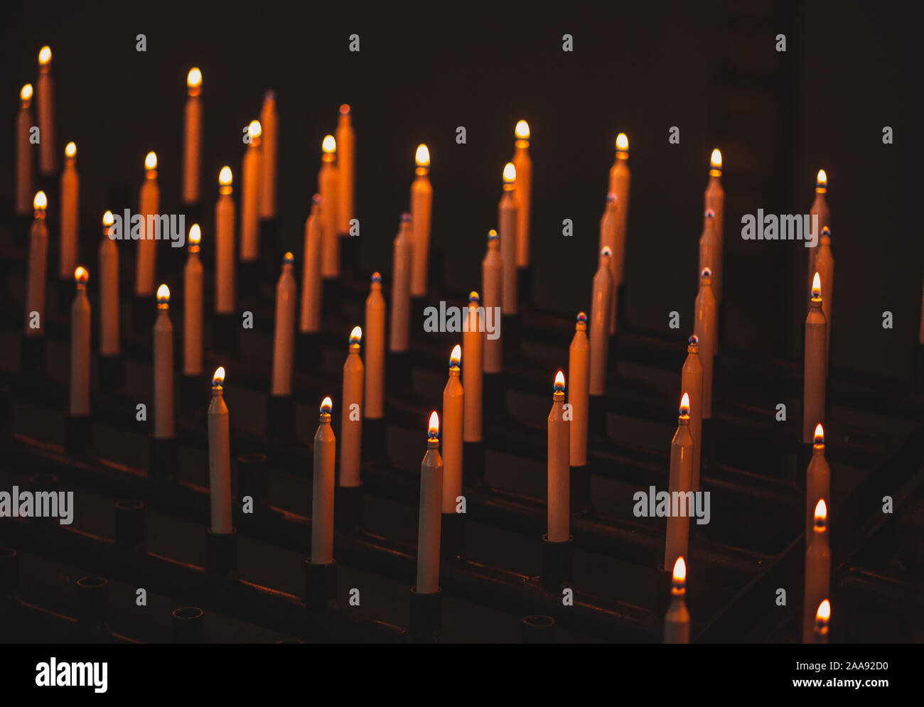 Candles are burning on the candlesticks in the church Stock Photo - Alamy