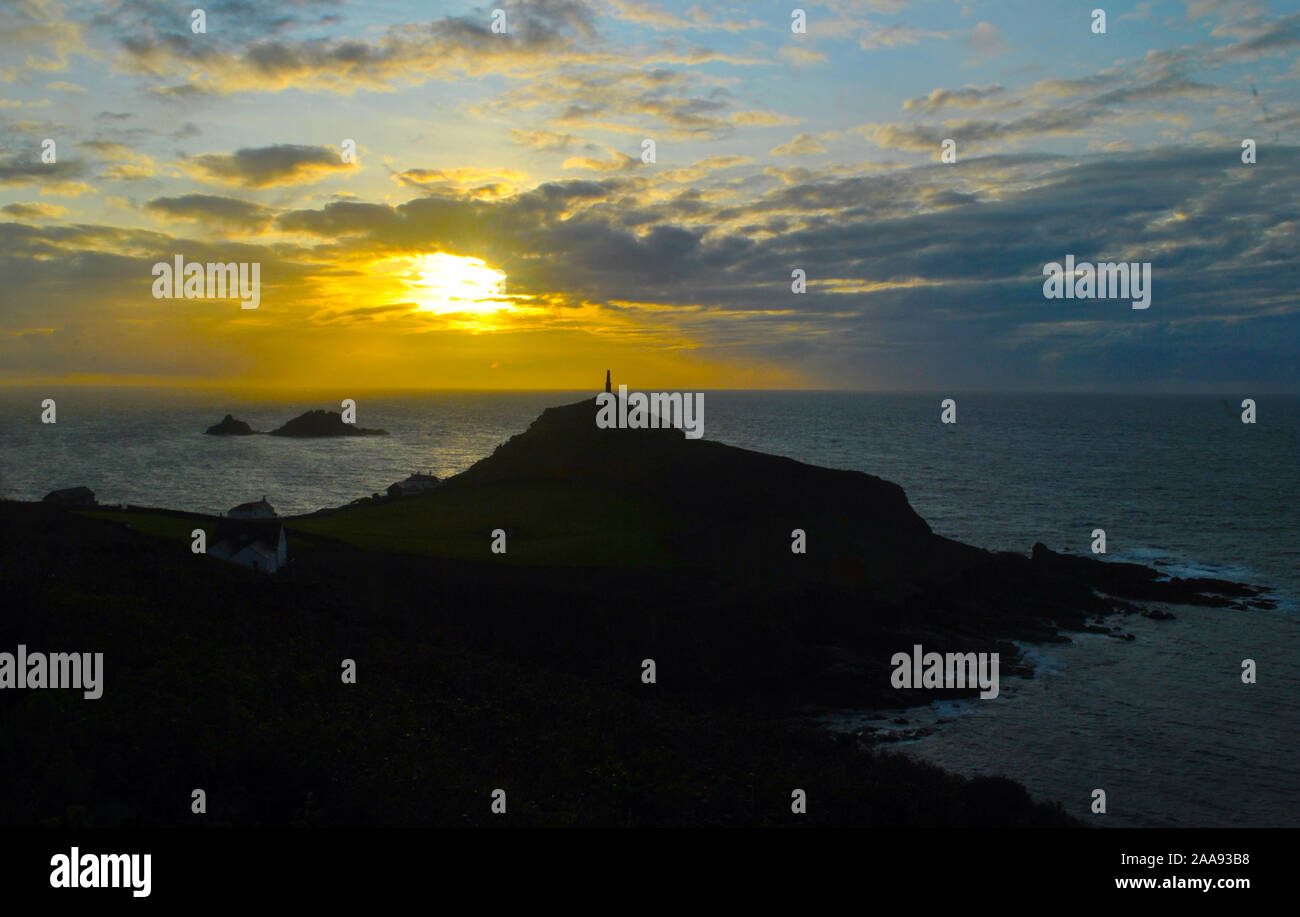 The golden sun over Cape Cornwall and The Brisons at the very end of ...