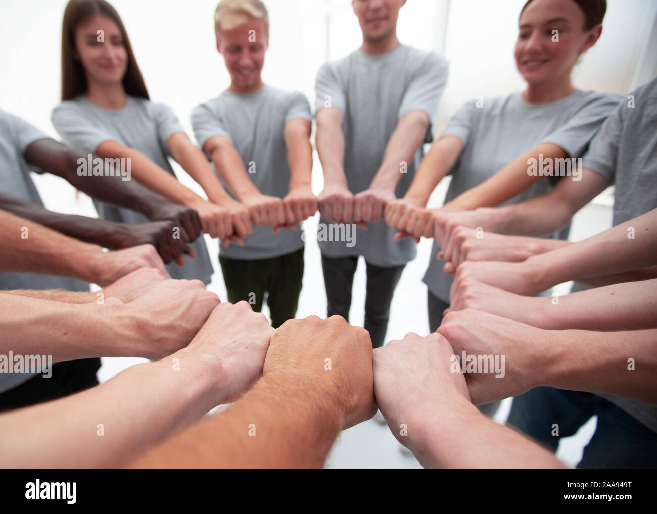 group of young people making a circle out of their hands Stock Photo ...