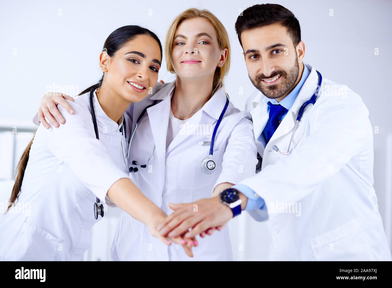 Doctors smiling together in hospital hi-res stock photography and ...