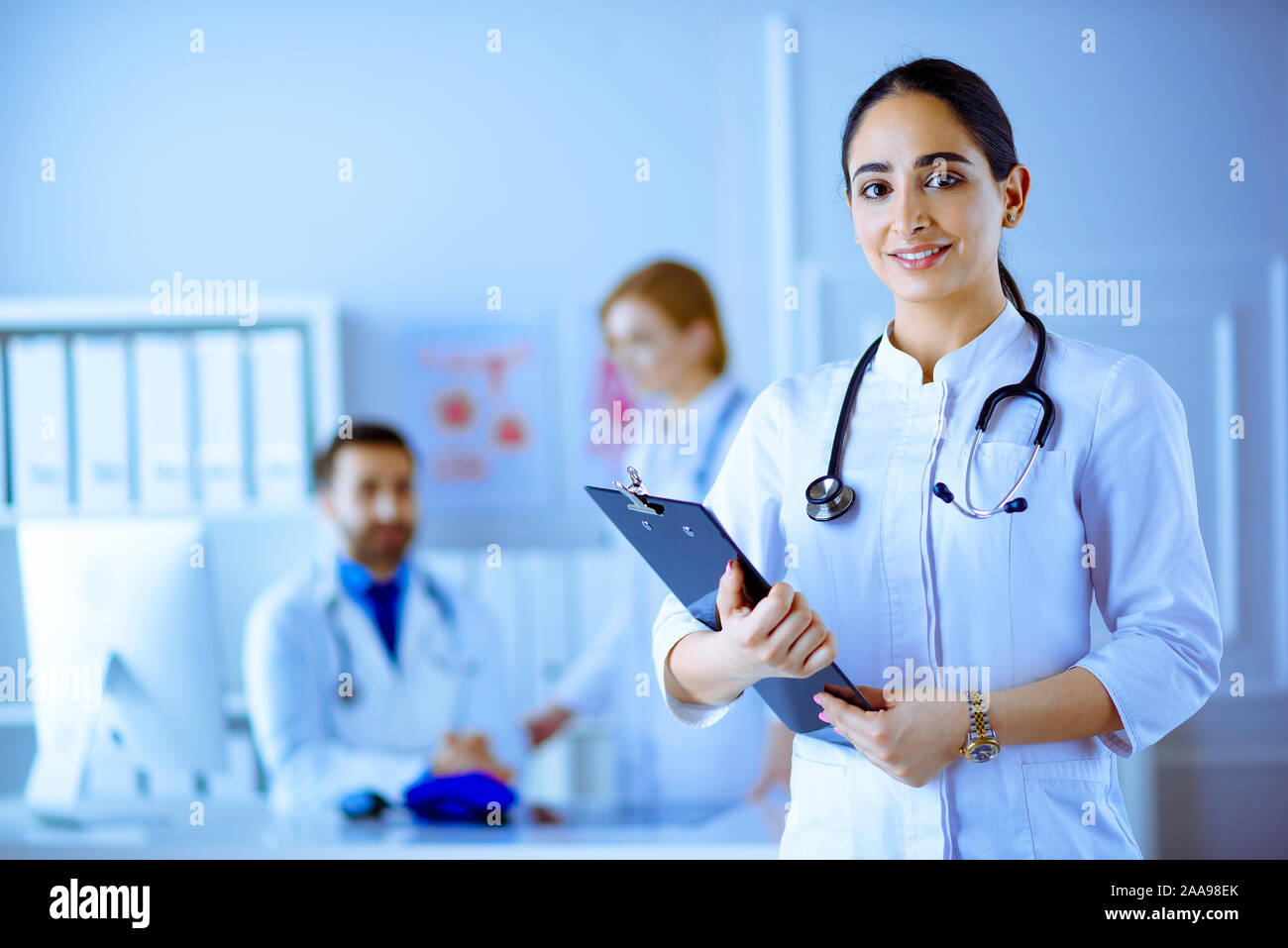 Arabian Doctor standing in Front of her team in the hospital Stock ...