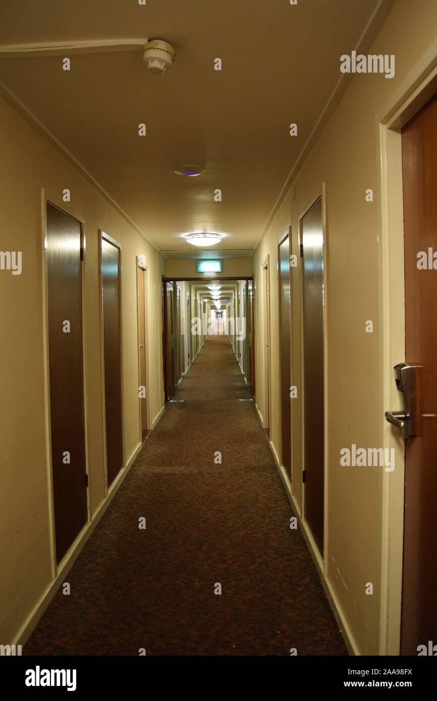 Long corridor with doors on both sides Stock Photo - Alamy