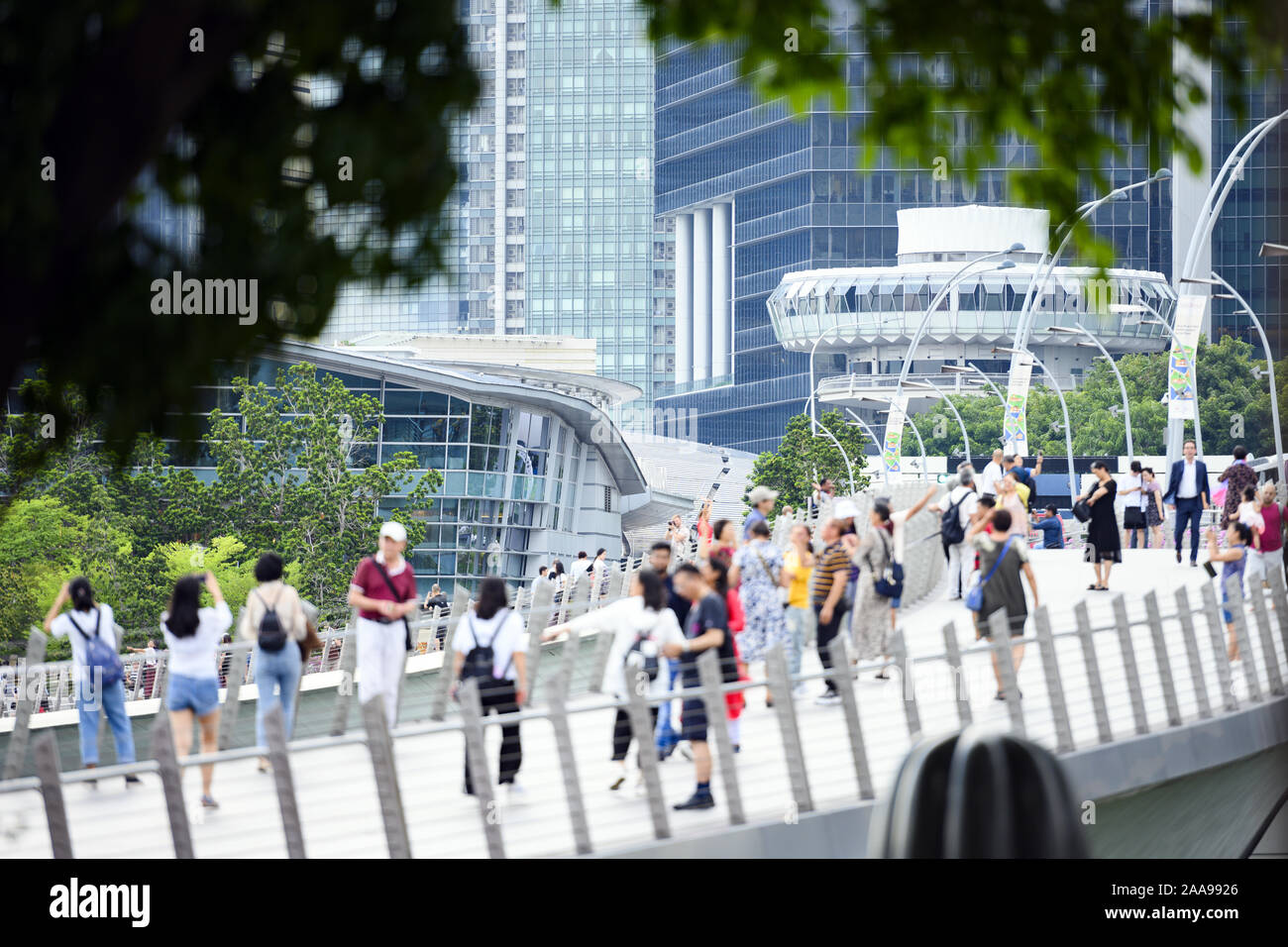 (Focus on the background) Defocused crowd of local people and tourists ...