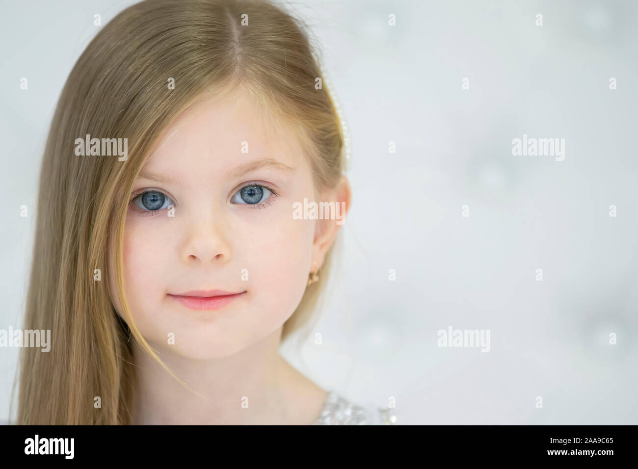 Portrait of a beautiful baby girl. The face of a five year old child ...