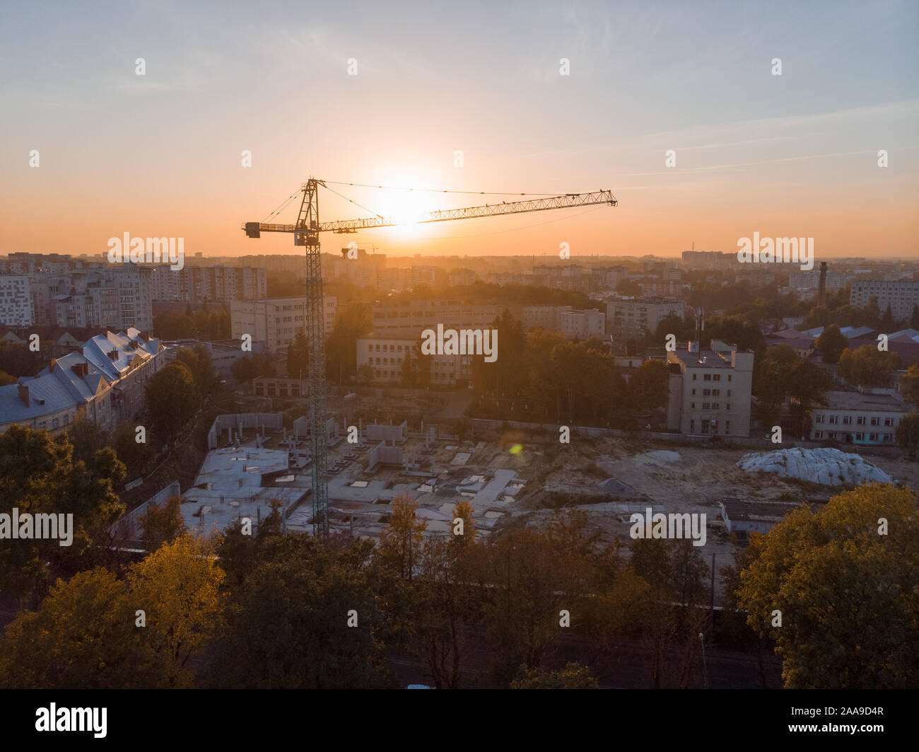construction building site crane on sunset Stock Photo - Alamy