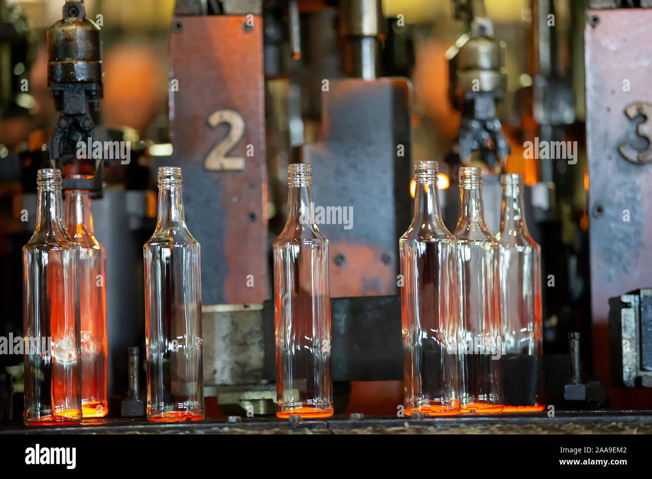 Glassworks. Glass industry. The process of making glass bottles Stock ...