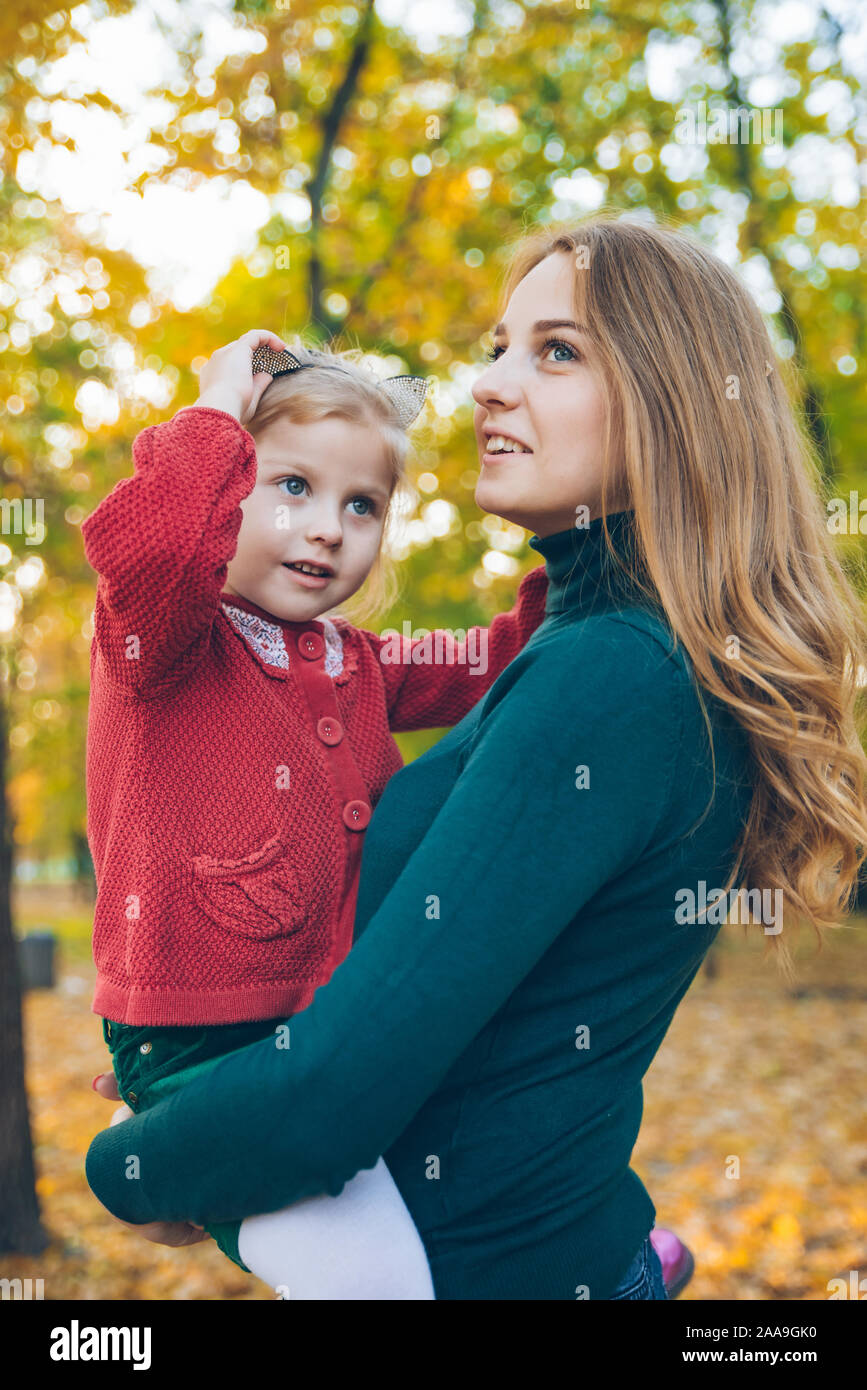 mother daughter love hug at autumn city park Stock Photo - Alamy