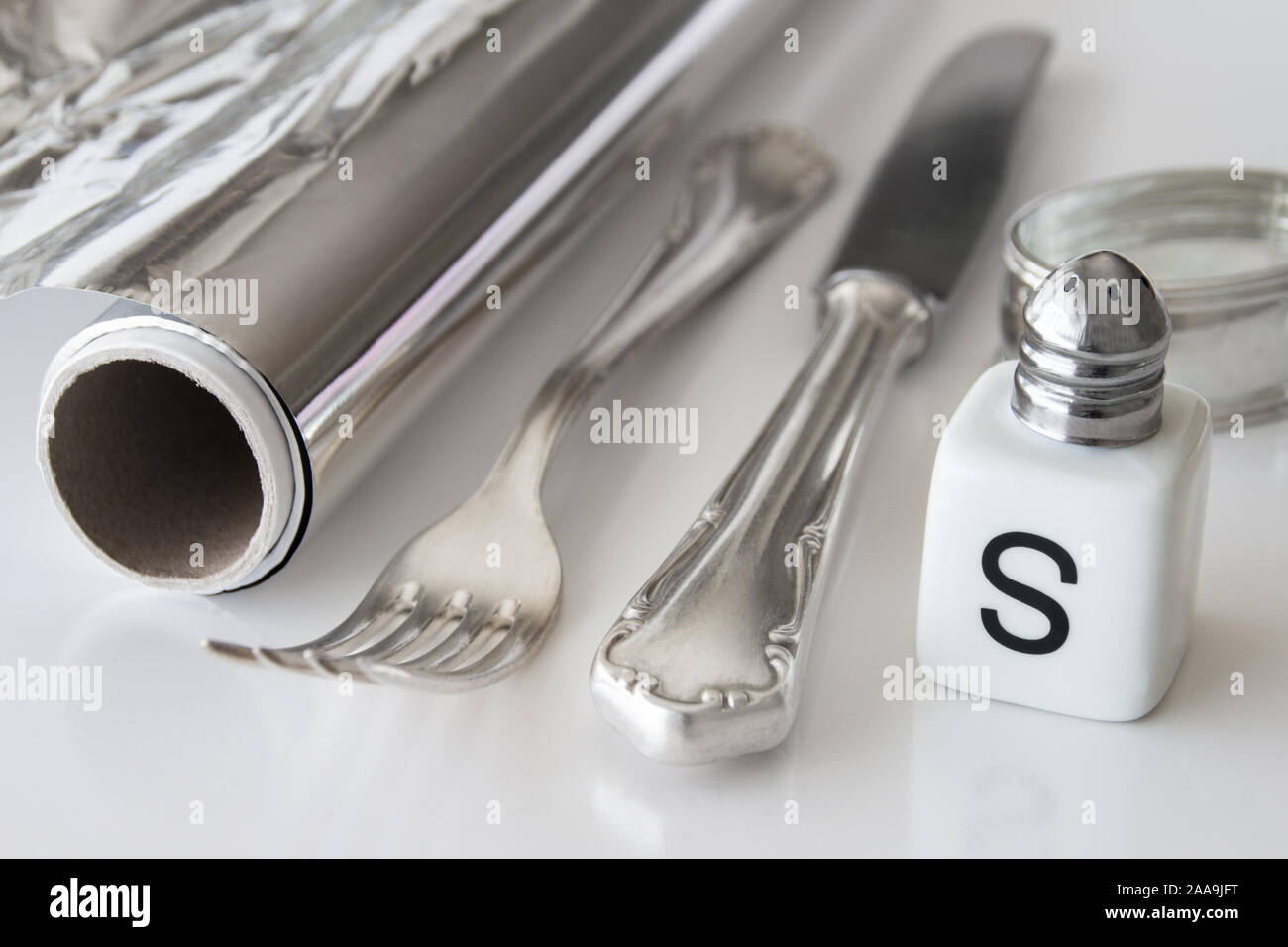 Household cleaning silver with salt and alufoil Stock Photo - Alamy