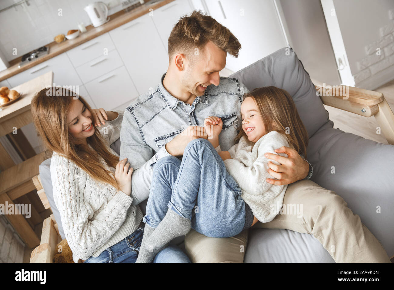 Family at home together leisure love concept playing Stock Photo - Alamy