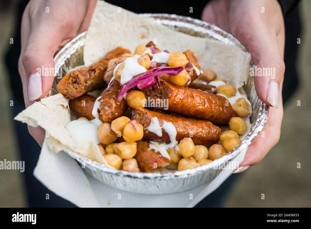 Basque Spanish chistorra sausage with chickpeas at a street food market ...