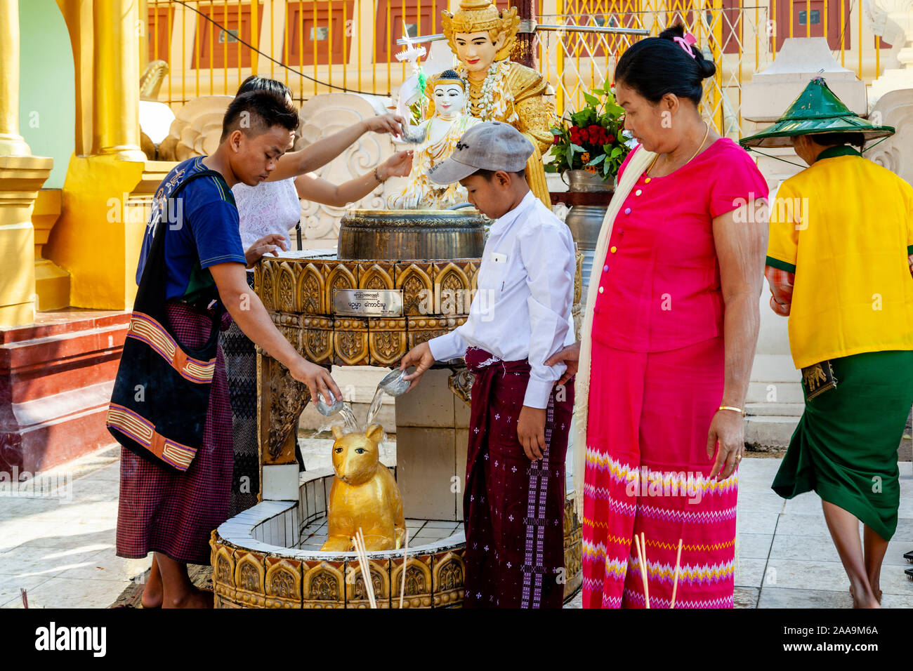 Buddhist People Take Part In The Ritual Of Pouring Water Over Buddhist ...
