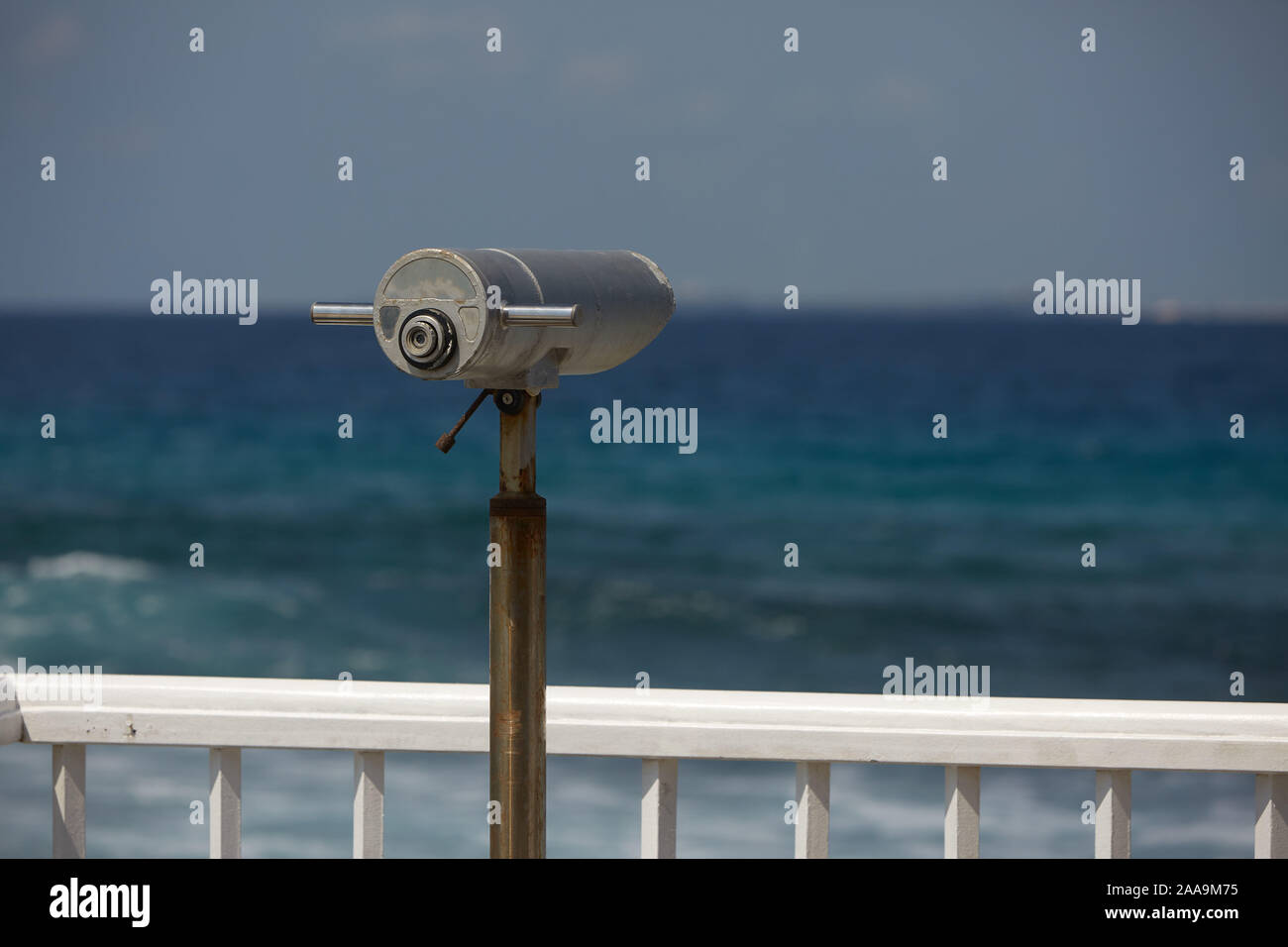 Beach guard telescope looking out towards sea views on surfer spot on ...