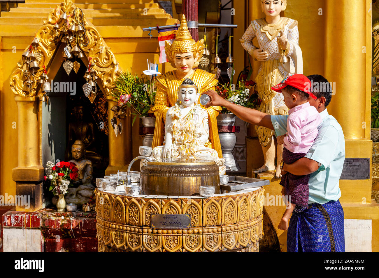 Buddhist People Take Part In The Ritual Of Pouring Water Over Buddhist ...