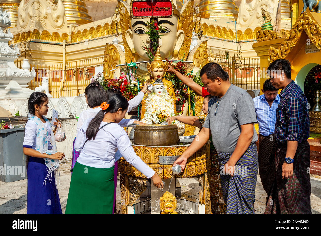 Buddhist People Take Part In The Ritual Of Pouring Water Over Buddhist ...