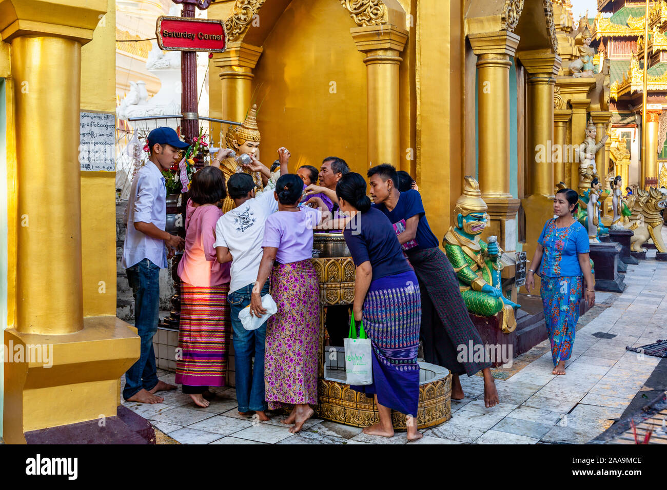 Buddhist People Take Part In The Ritual Of Pouring Water Over Buddhist ...