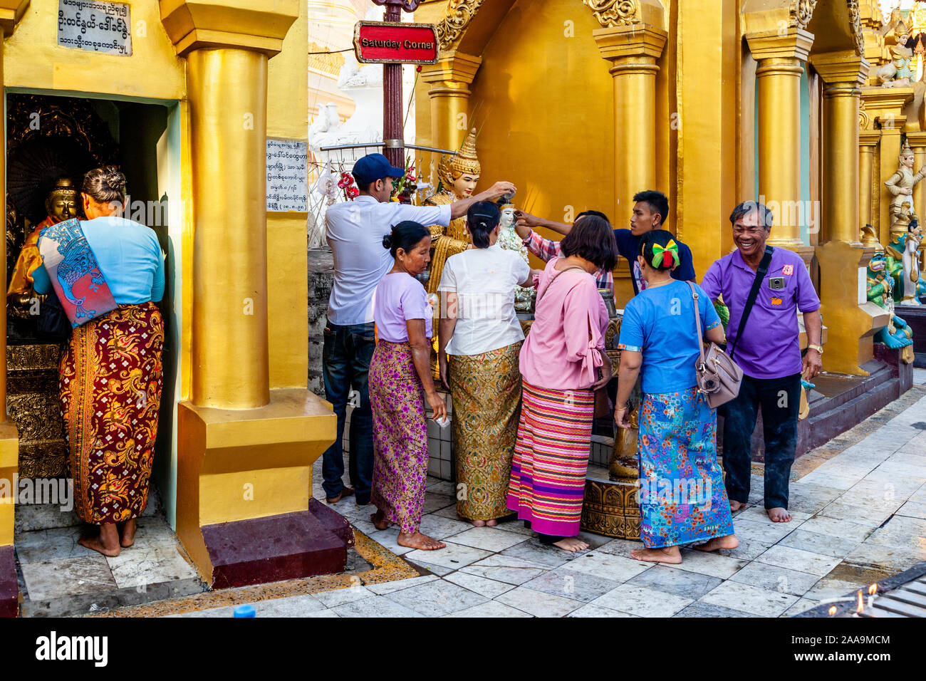 Buddhist People Take Part In The Ritual Of Pouring Water Over Buddhist ...