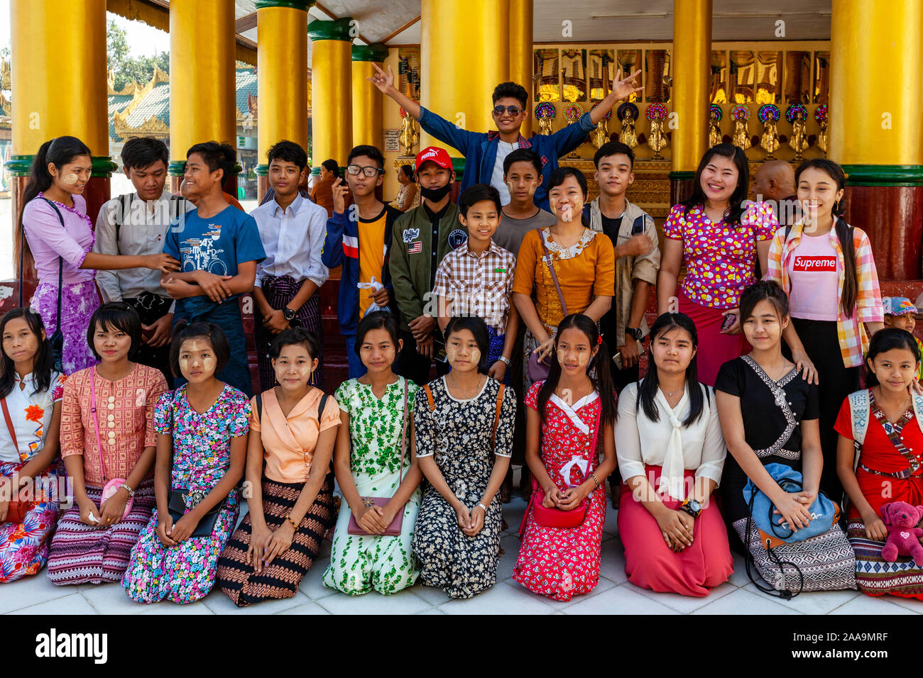 A Group Of Burmese Visitors Pose For A Photo At The Shwedagon Pagoda ...