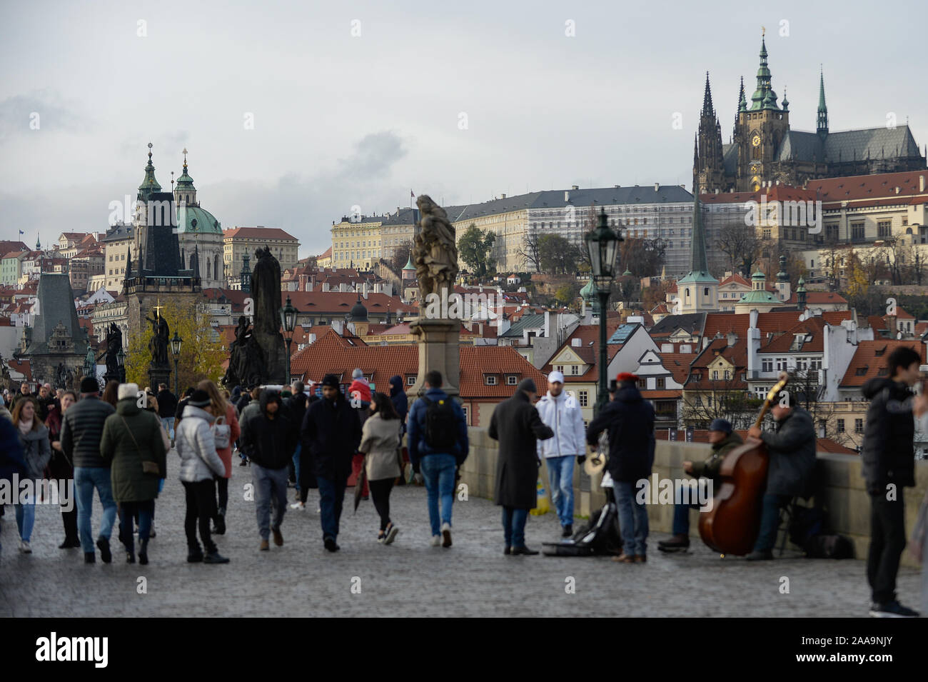 Prague, Czech Republic. 18th Nov, 2019. Tourists walk on the pedestrian Charles Bridge.Prague ...