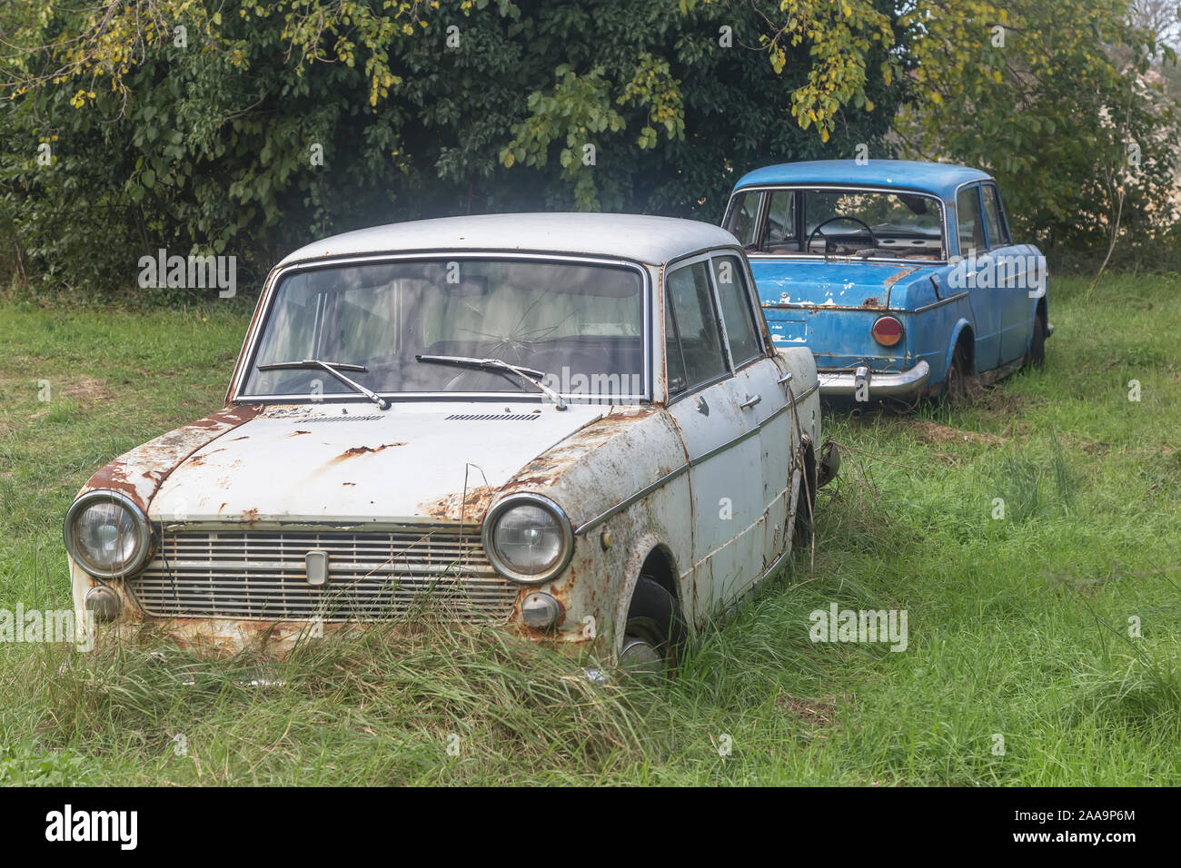 two old cars abandoned in the yard Stock Photo - Alamy