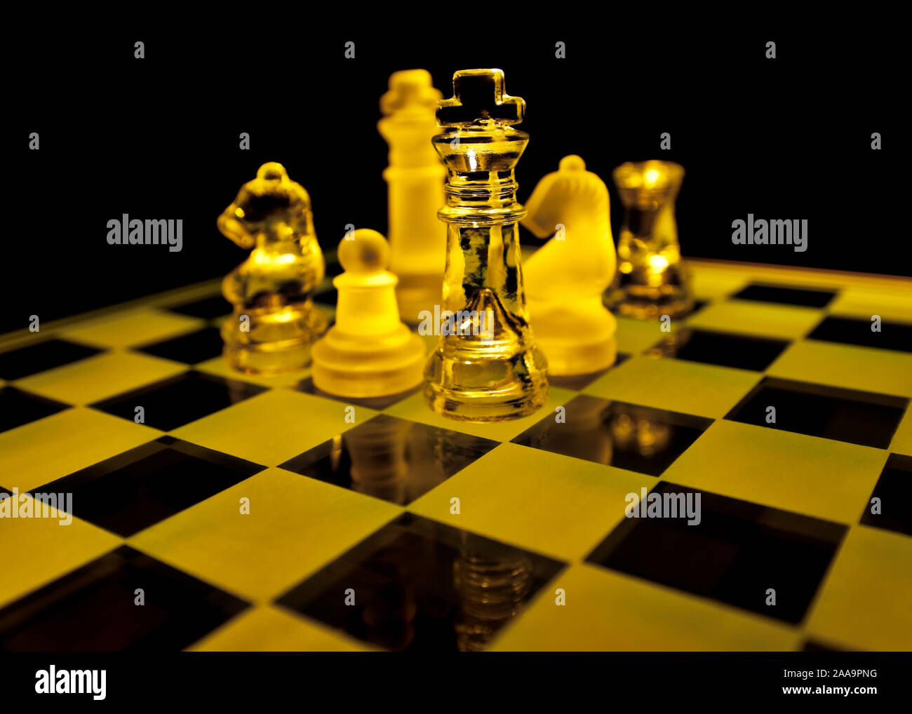 Glass Chess Board and Pieces in Yellow Stock Photo - Alamy
