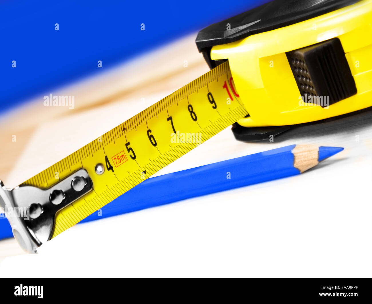 Measuring tape and blue pencil Stock Photo - Alamy